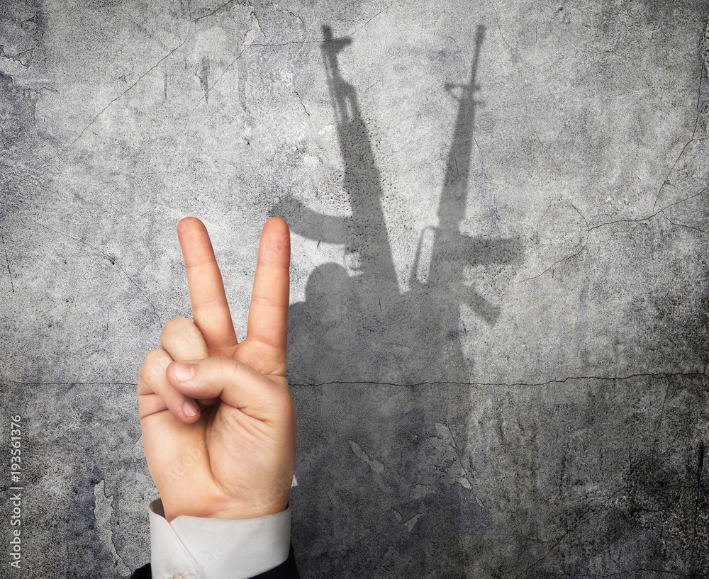 Concept of propaganda. The hand folded into the symbol of the world ...