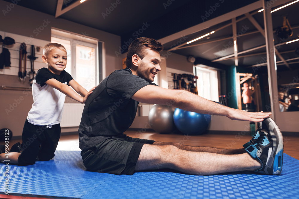 Father and son in the gym. Father and son spend time together and lead ...