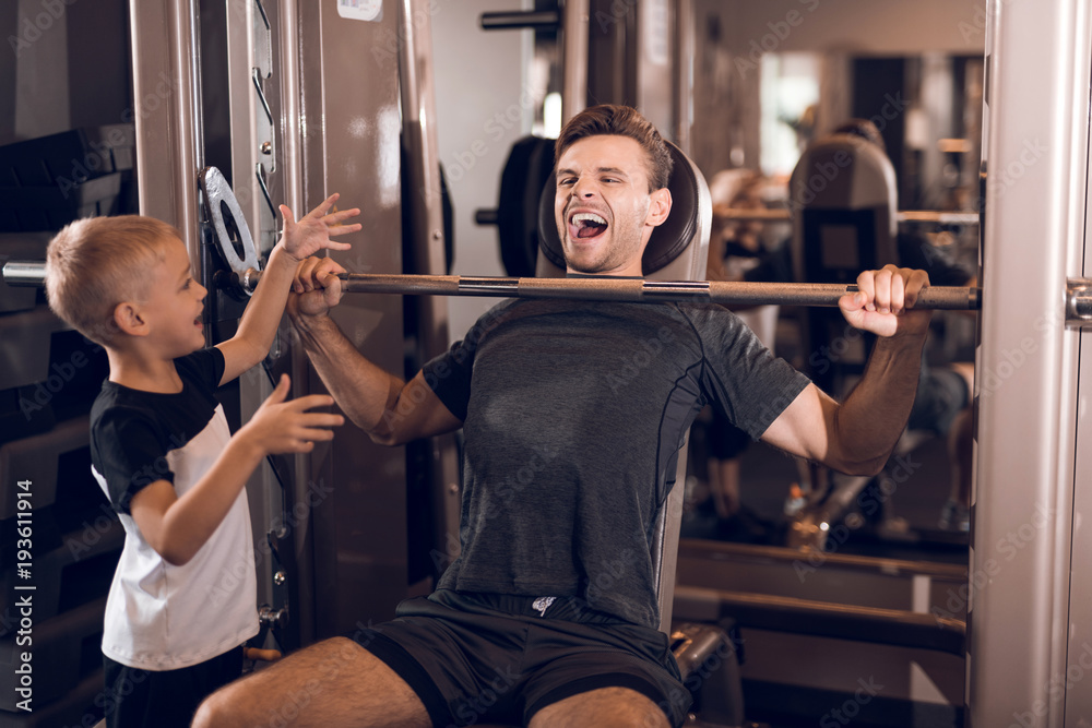 Father and son in the gym. Father and son spend time together and lead ...