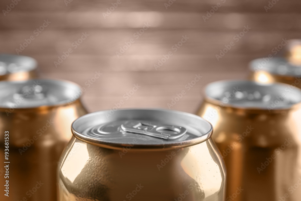 Cans of beer on blurred background, closeup Stock Photo | Adobe Stock