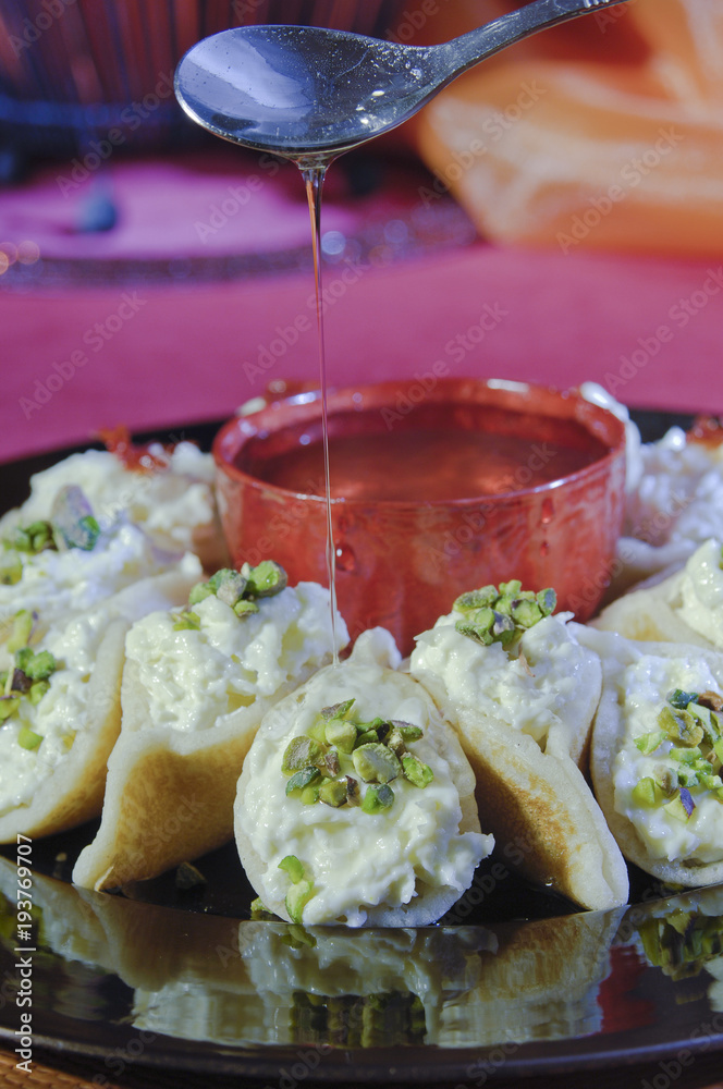 Pouring Syrup on Asafeer, Arabic Sweets for Ramadan and Eid Stock Photo ...