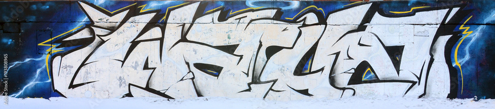 The old wall, painted in color graffiti drawing red aerosol paints ...