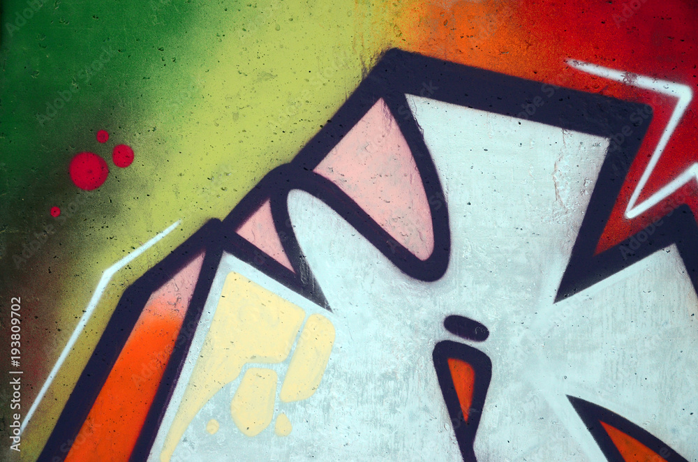 The old wall, painted in color graffiti drawing red aerosol paints ...