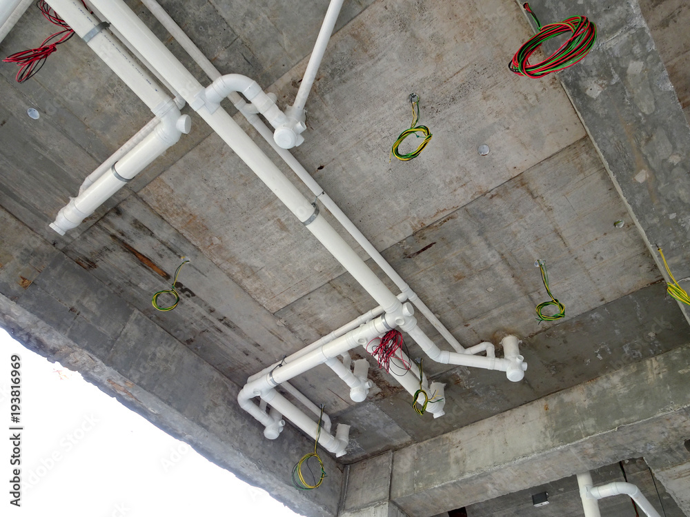 UPVC sewerage pipe below toilet's soffit under construction at the ...