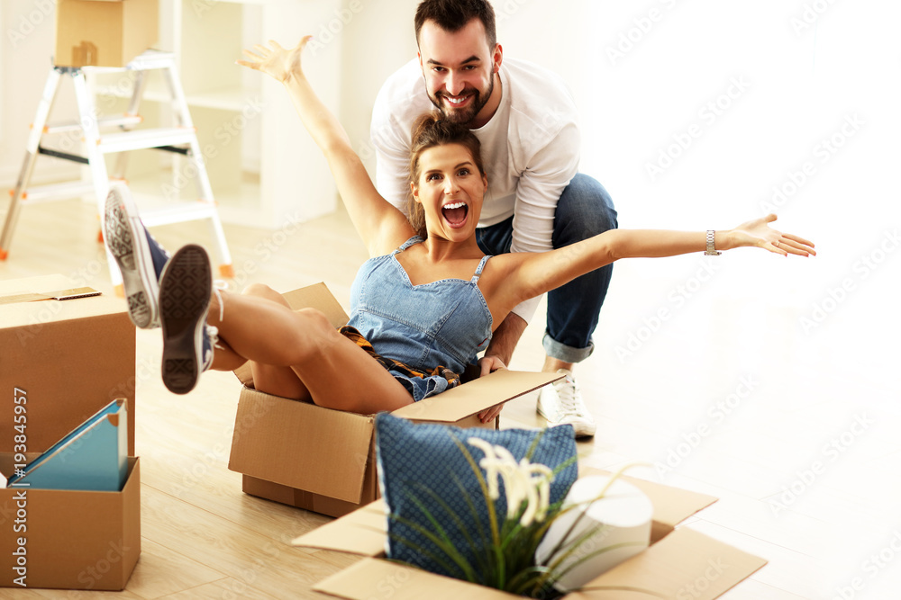 Happy adult couple moving out or in to new home Stock Photo | Adobe Stock