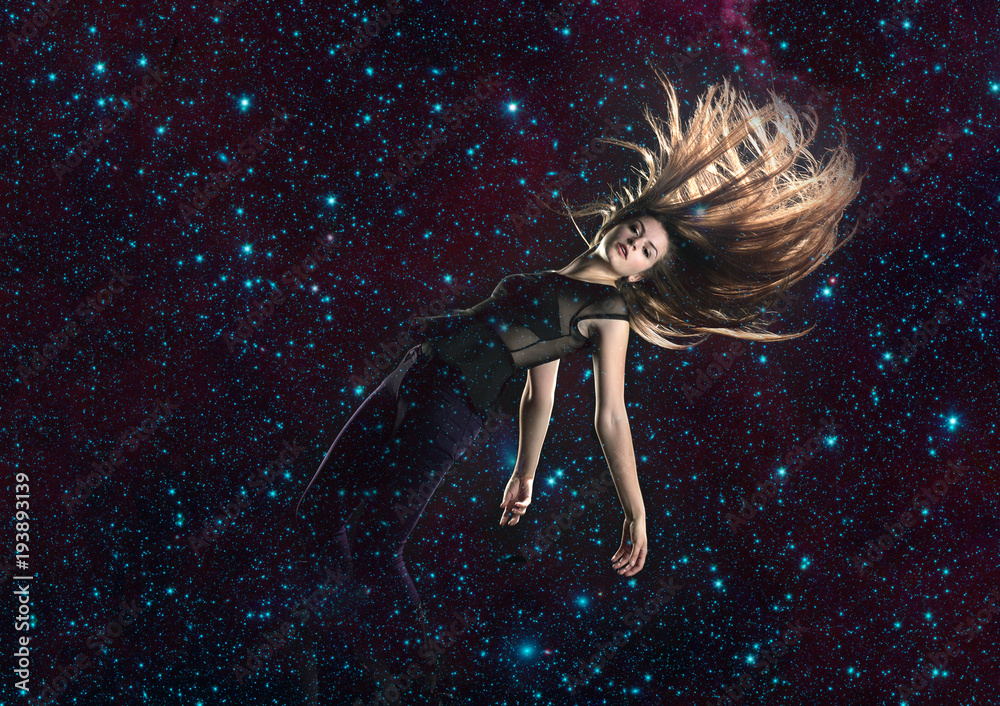 Beautiful, long haired woman falling through stars in space, elements ...