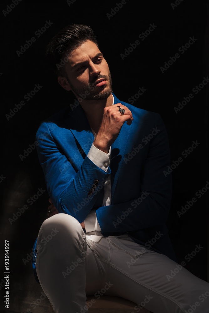 dramatic sexy man sitting and thinking Stock-Foto | Adobe Stock