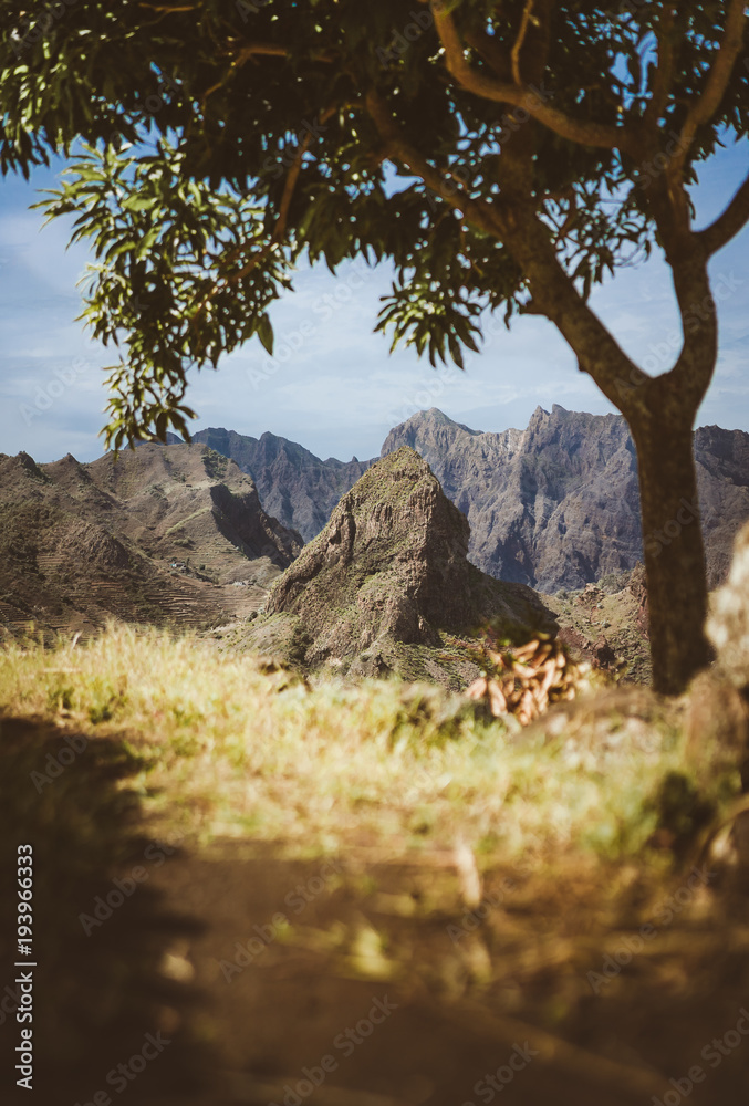 Amazing huge barren mountain range appearing on the horizon. Glowing ...