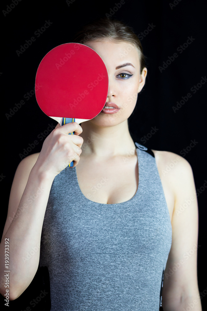 The athlete covered half of her face with a tennis racket. Beautiful ...
