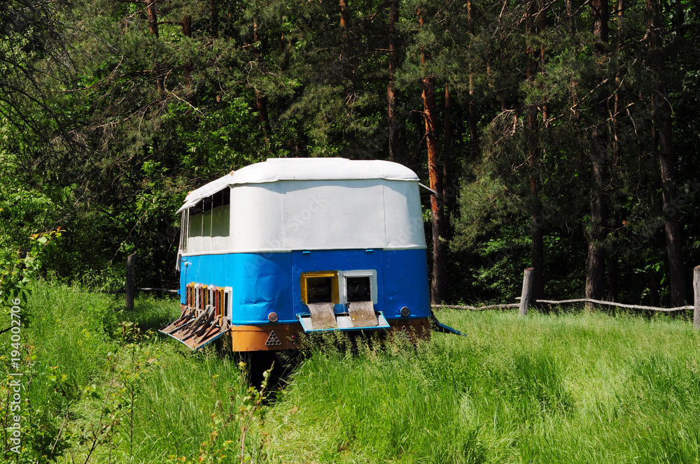 Old colorful bus with colorful beehive panels. Natural Beekeeping with ...