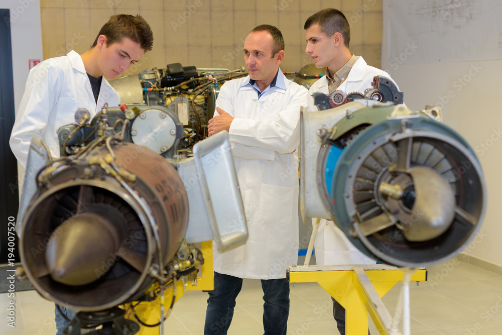 2 trainees aircraft propulsion engineers with teacher Stock Photo ...