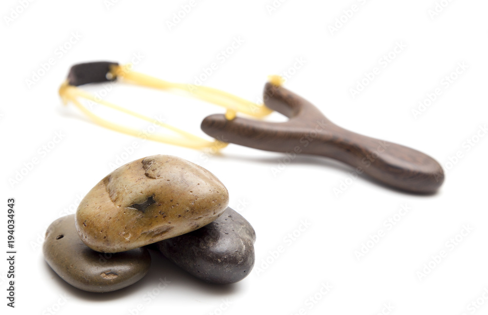 Slingshot Representing the Fight Between David and Goliath on a White ...