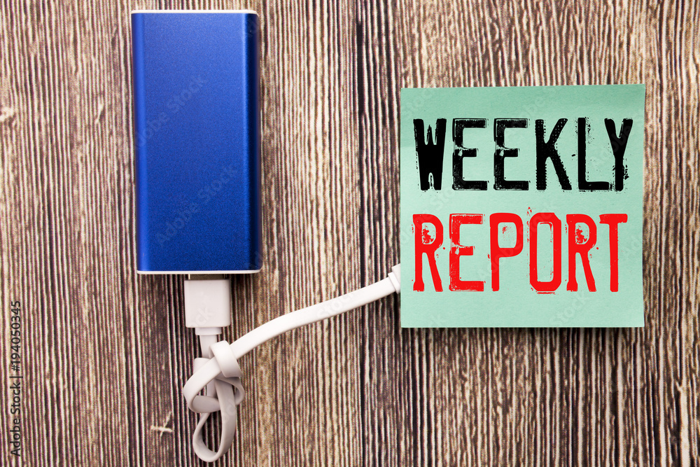Handwritten text caption showing Weekly Report. Business concept ...