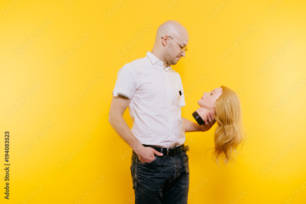 Excited odd bizarre strange unusual adult bald hairless man holding ...