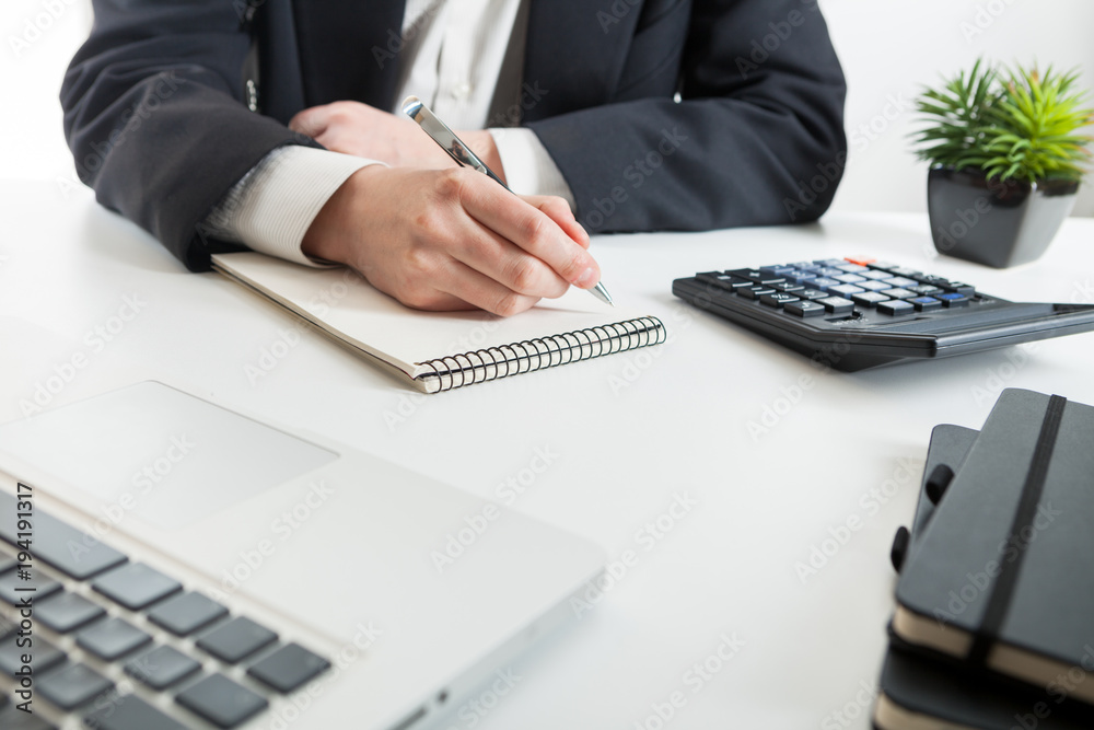 Close up view of bookkeeper or financial inspector hands making report ...