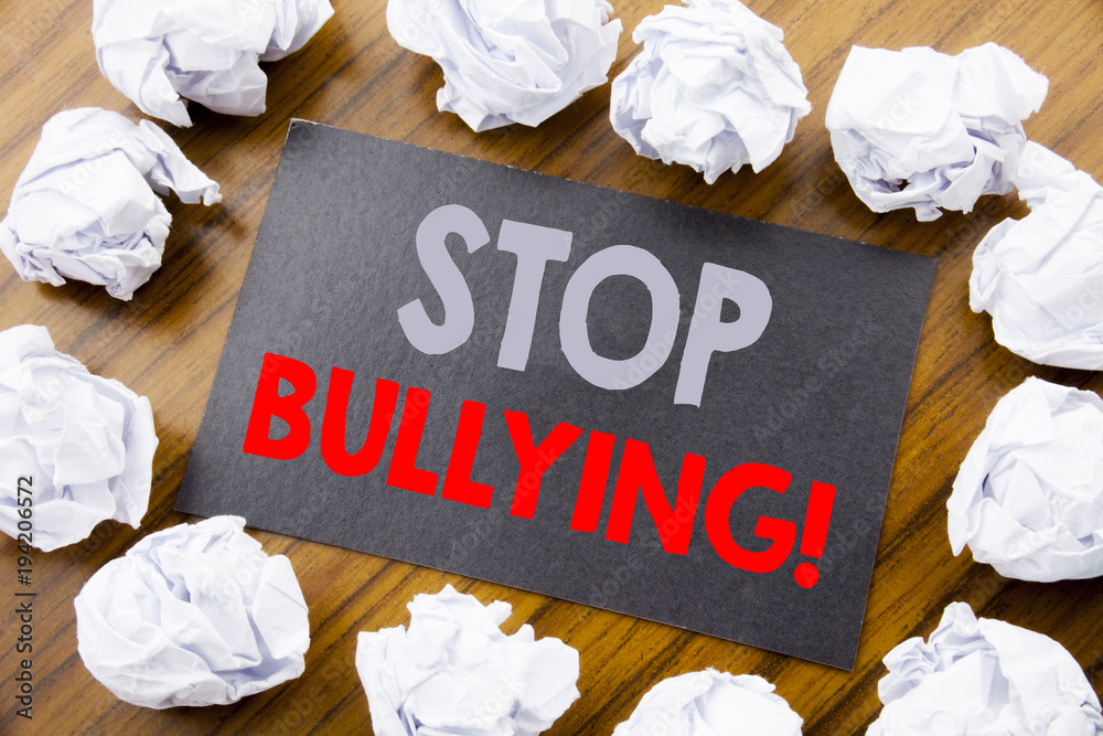 Hand writing text caption showing Stop Bullying. Business concept for ...