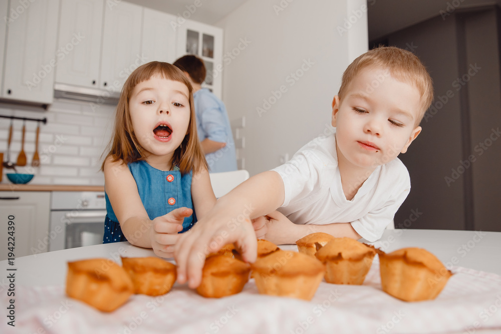 Children are stretching for freshly prepared cupcakes, sister shares ...