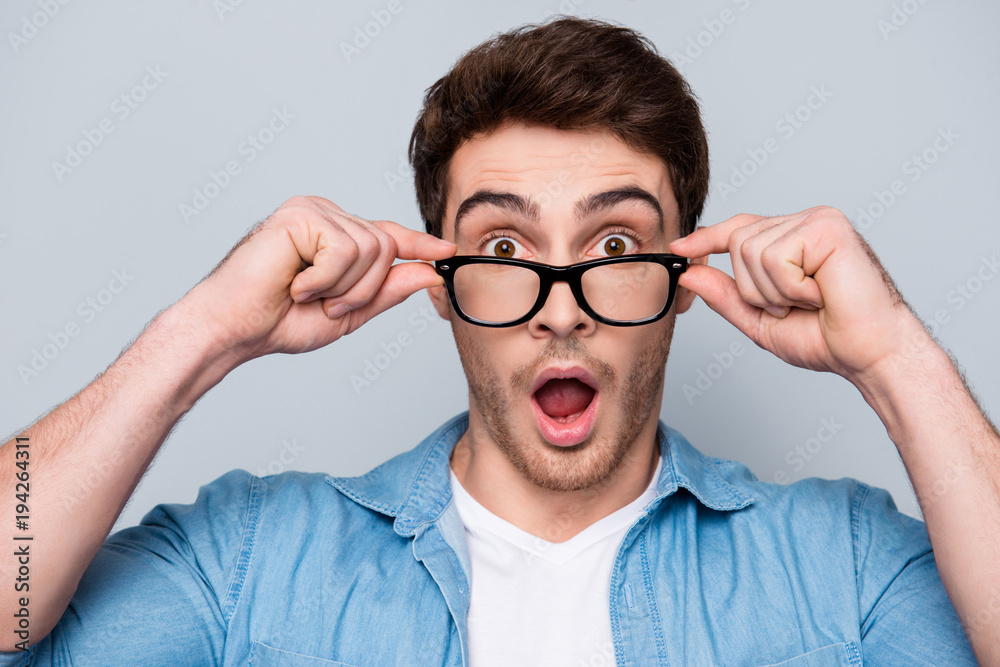 Close up portrait of astonished, shocked, attractive guy holding ...