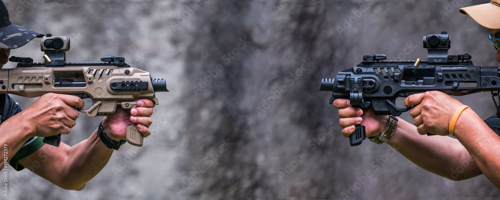 Males aim 9mm pistol gun with conversion kit to carbine and shoot to ...