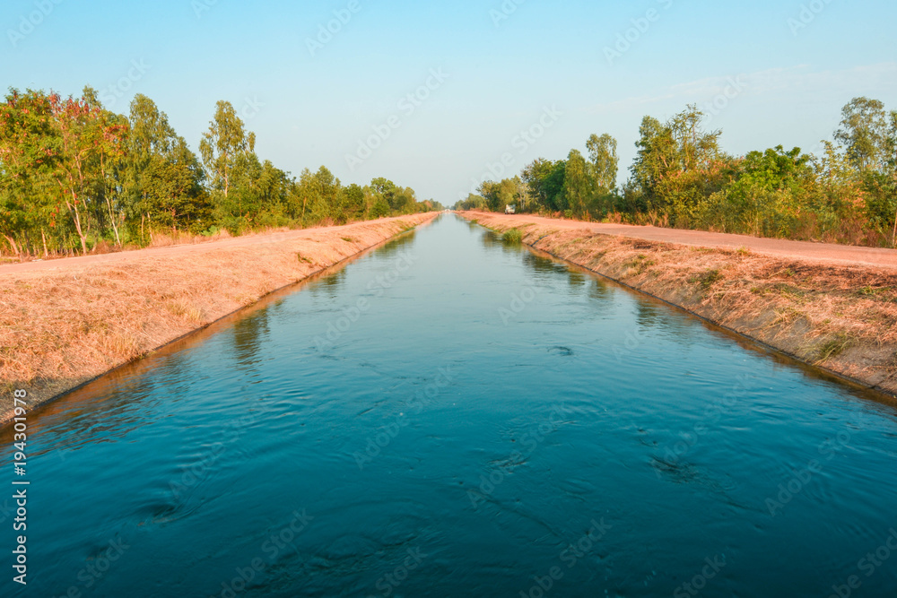Poster Irrigation canal that sends water from the dam With reinforced ...