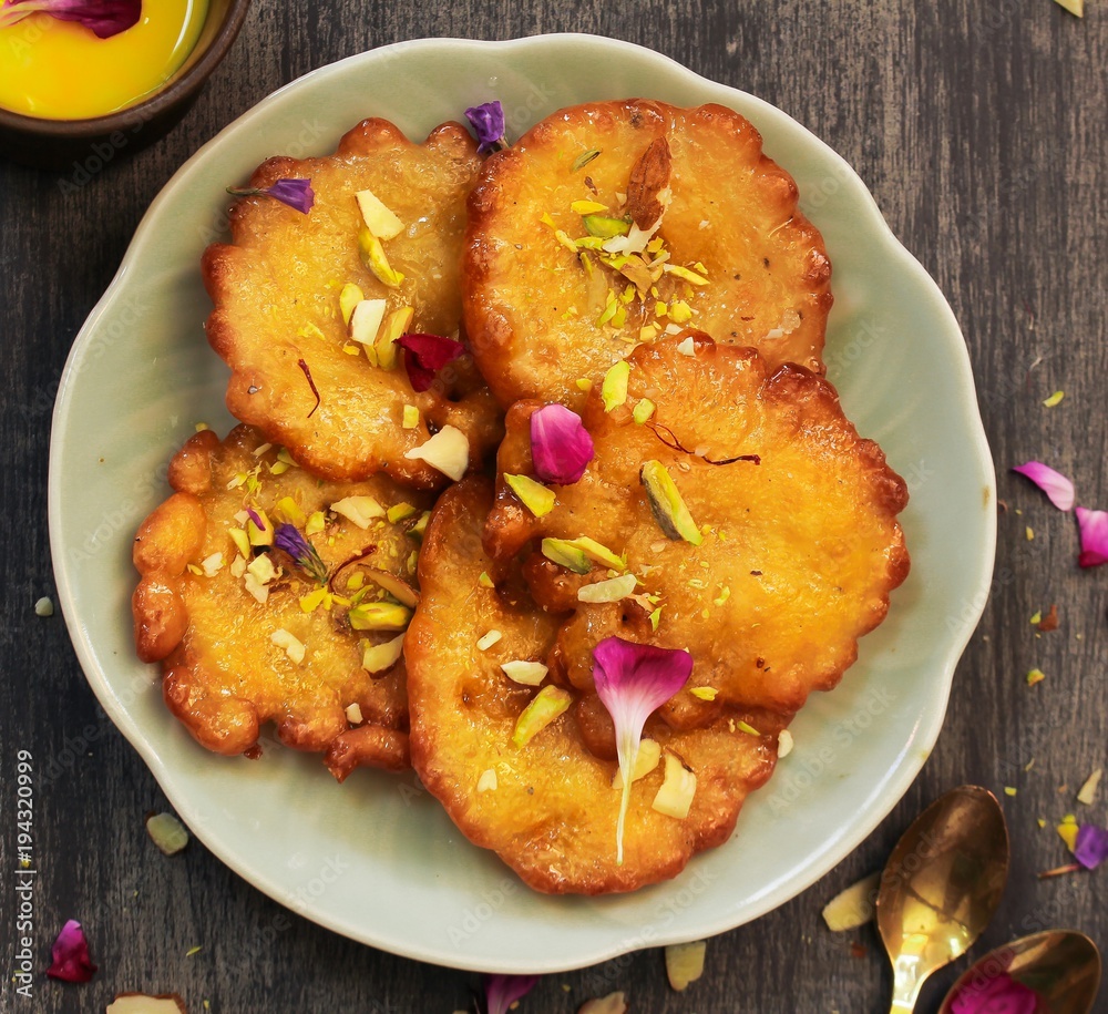 Malpua - Traditional Indian sweet pancake coated in sugar syrup Stock ...