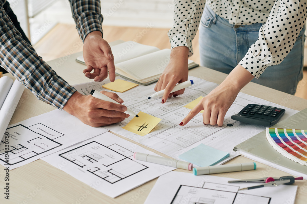 Discussing blueprint Stock Photo | Adobe Stock