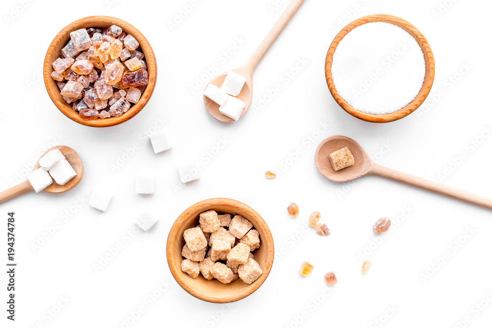 Sugar background on white. Bowls with different kinds of sugar. Top ...