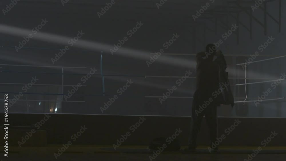 Back view of young boxer on grunge background. Fighter man silhouette ...