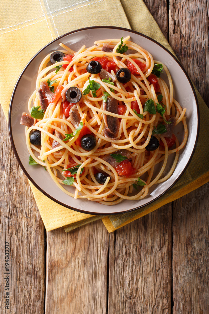 Spaghetti alla putanesca with anchovies, tomatoes, garlic and black ...