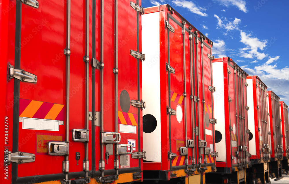 Row of Cargo Containers Trucks Parked Lot with Sunset Sky. Shipping ...