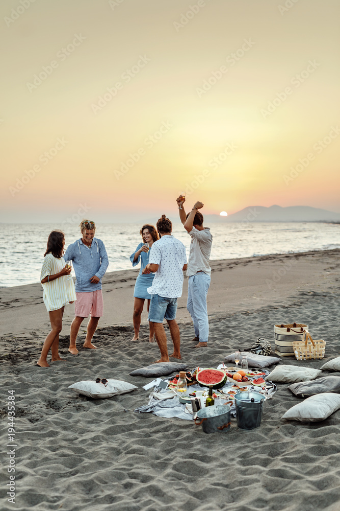 Friends Having Beach Party Stock Photo | Adobe Stock