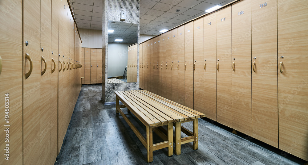 Interior of a locker room. Clean empty dressing room with big lockers ...