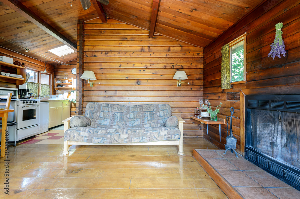 Cozy interior of a rustic log cabin with a kitchen and fireplace. Stock ...