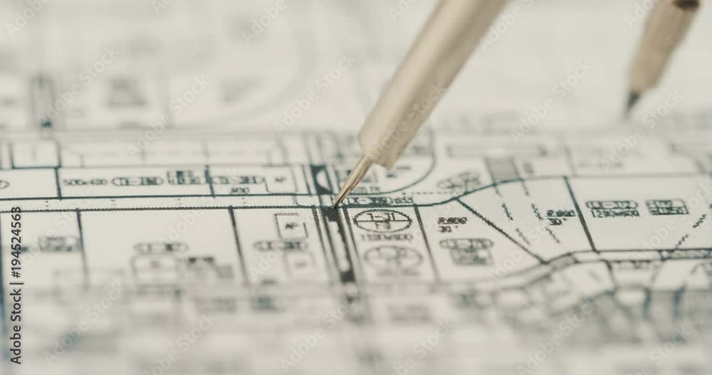 Macro shooting of the compass drawing a round on the chart with numbers ...