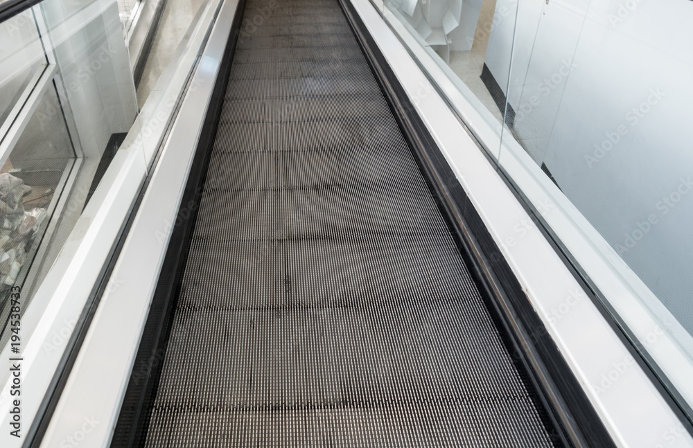 Escalator in metro. Moving down staircase. escalator. electric escalator.Close up to escalators ...
