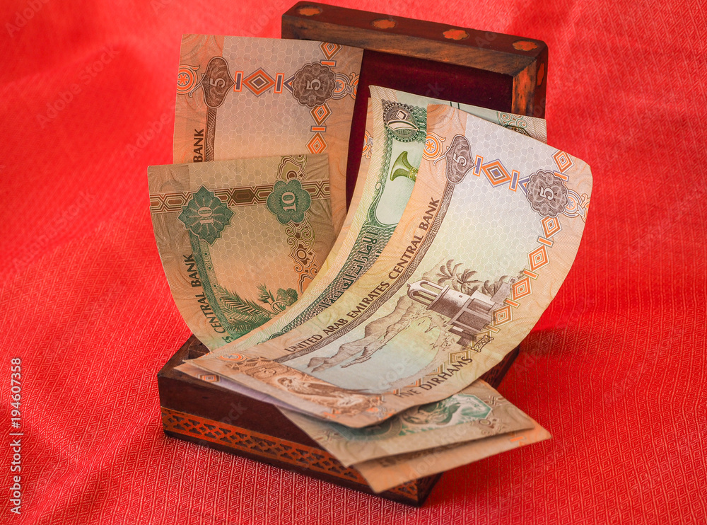 Arabic money dirham currency notes and coins. The money in the box ...