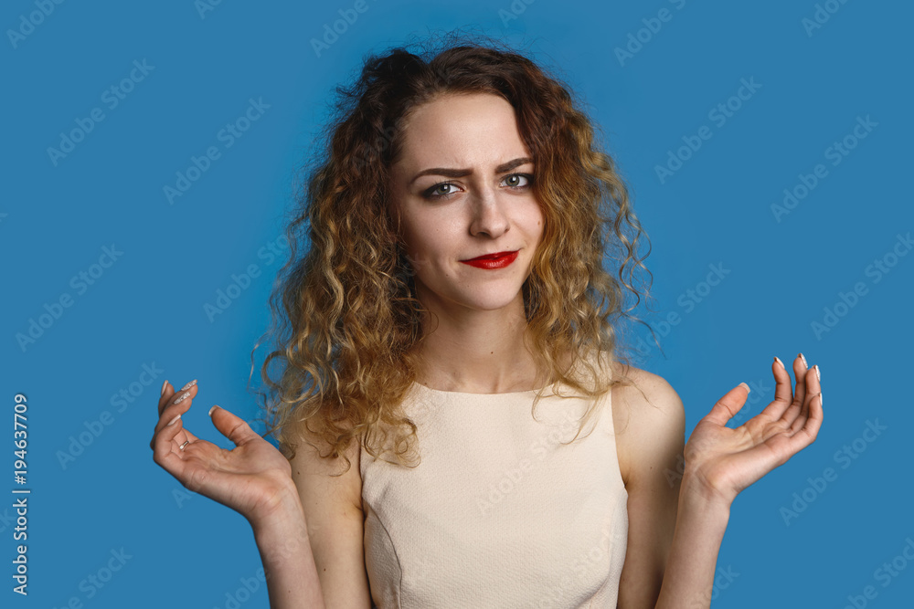 Horizontal shot of beautiful young female model with voluminous hair ...