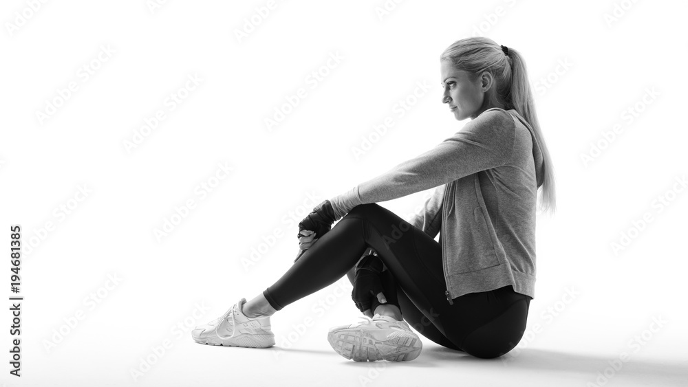 Woman Sitting On Floor Side View