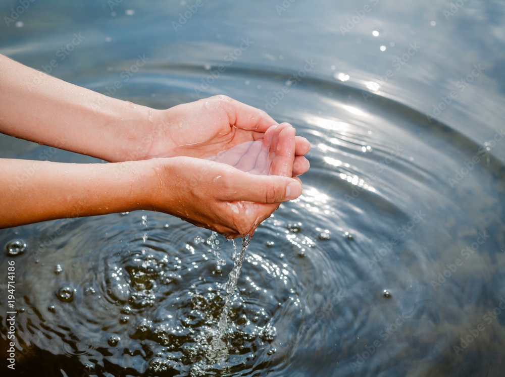Person taking raw unfiltered water from a lake by hands Stock Photo ...