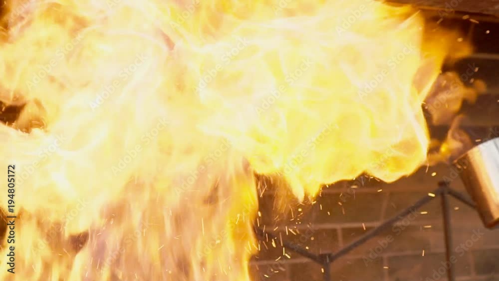 Vídeo do Stock: The live coals are being poured with fire fluid from ...