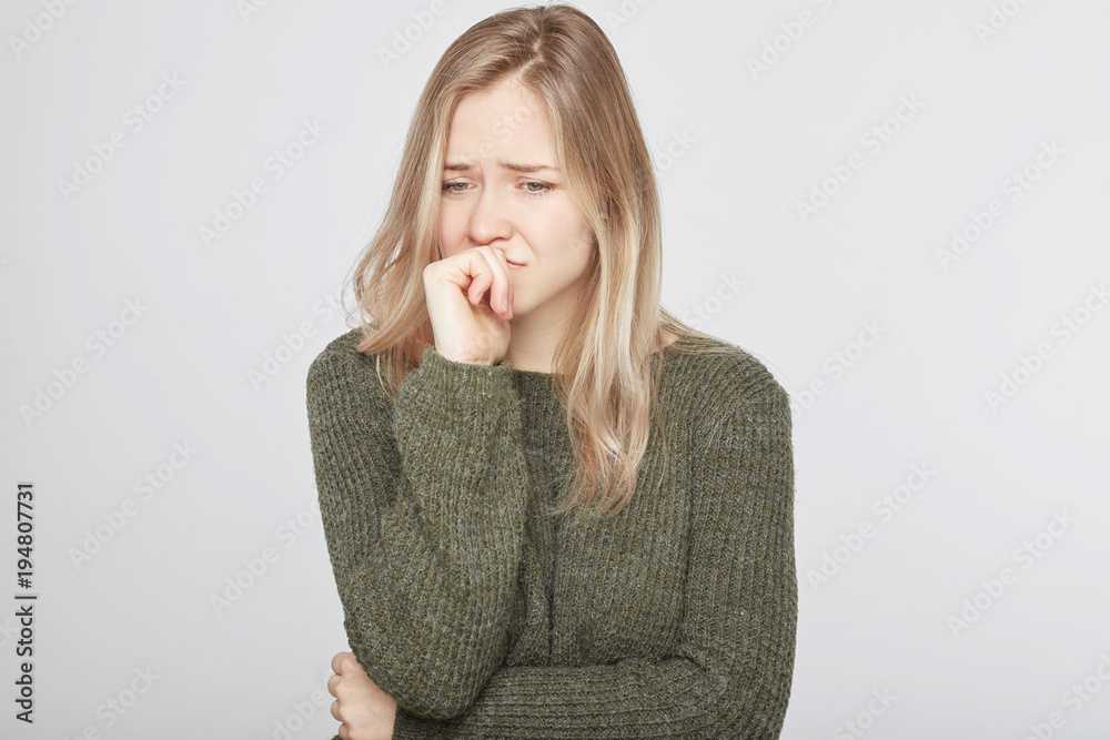 Shot view of troubled exhausted woman with sorrowful and haggard look ...