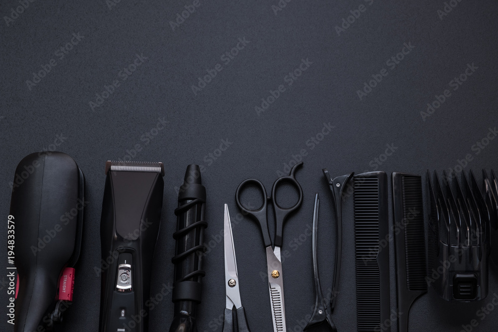 tools for haircuts and hair styling on a black background Stock Photo ...