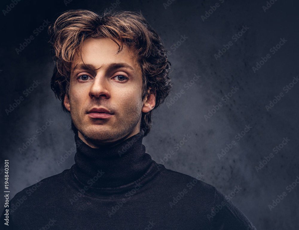 Portrait of a charismatic sensual male in black sweater. Creativ Stock ...