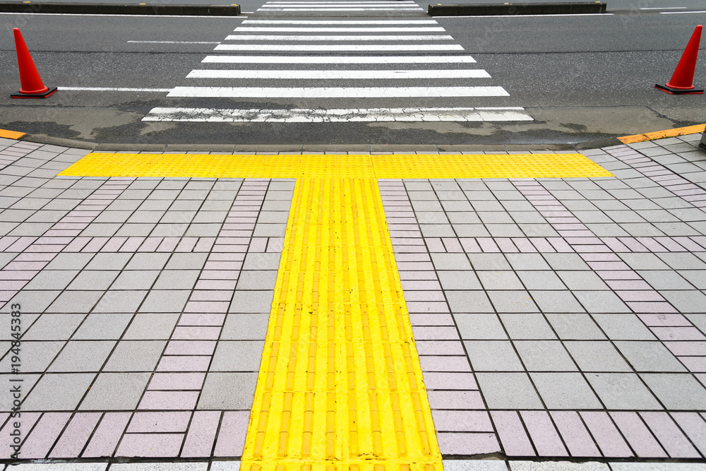 Pavement with Yellow line step for blind waiting standing on the ...