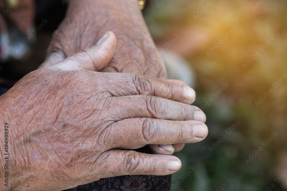 Hands Asian elderly woman grasps her hand on lap, pair of elderly ...