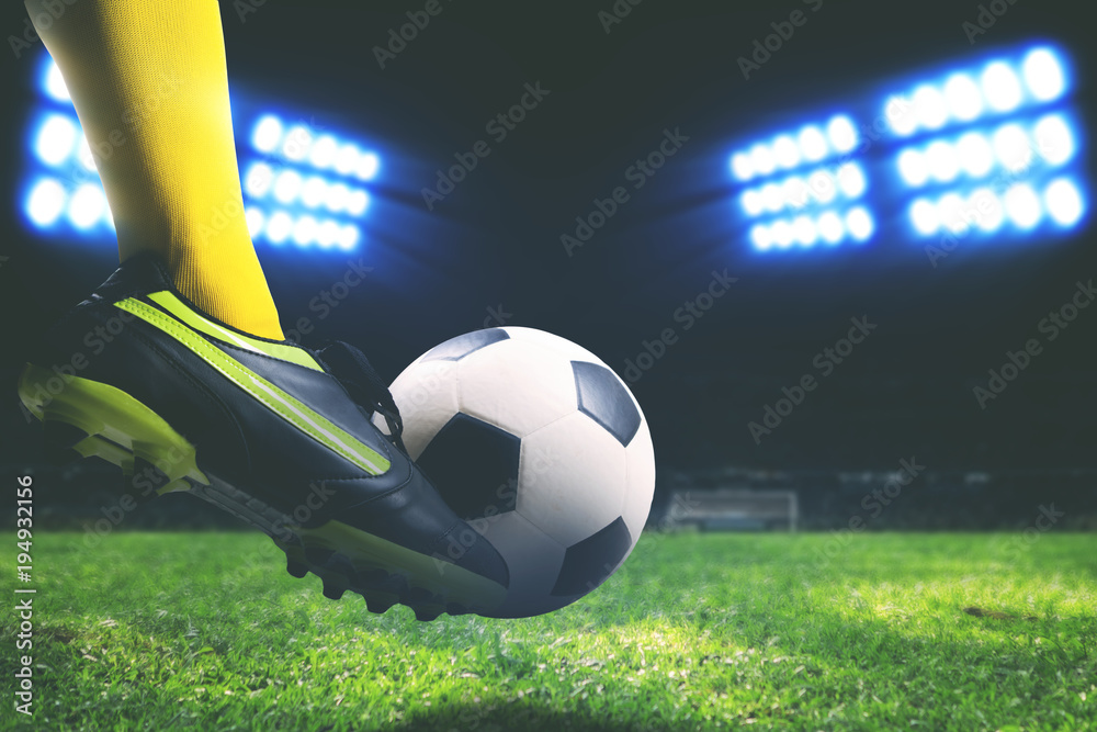 A Foot Kicking A Soccer Ball