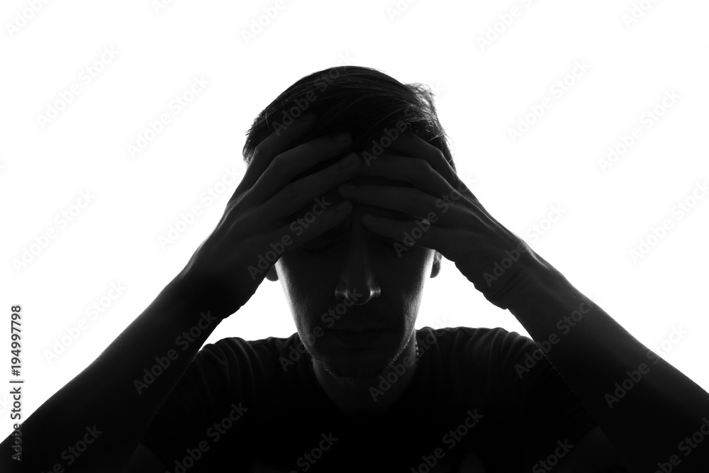 Male person silhouette hidden here face,back lit silhouette over white ...