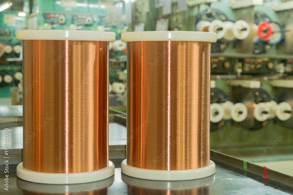 Standard copper wire enamel in a bobbin on the table, steel floor in ...