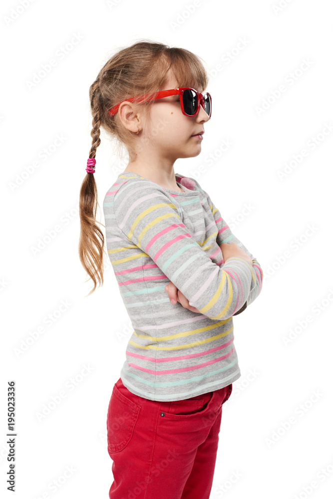 Side view of a child girl standing with folded hands, isolated on white ...