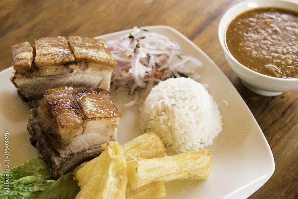 Chancho al cilindro, typical food of Peruvian cuisine. Stock Photo ...